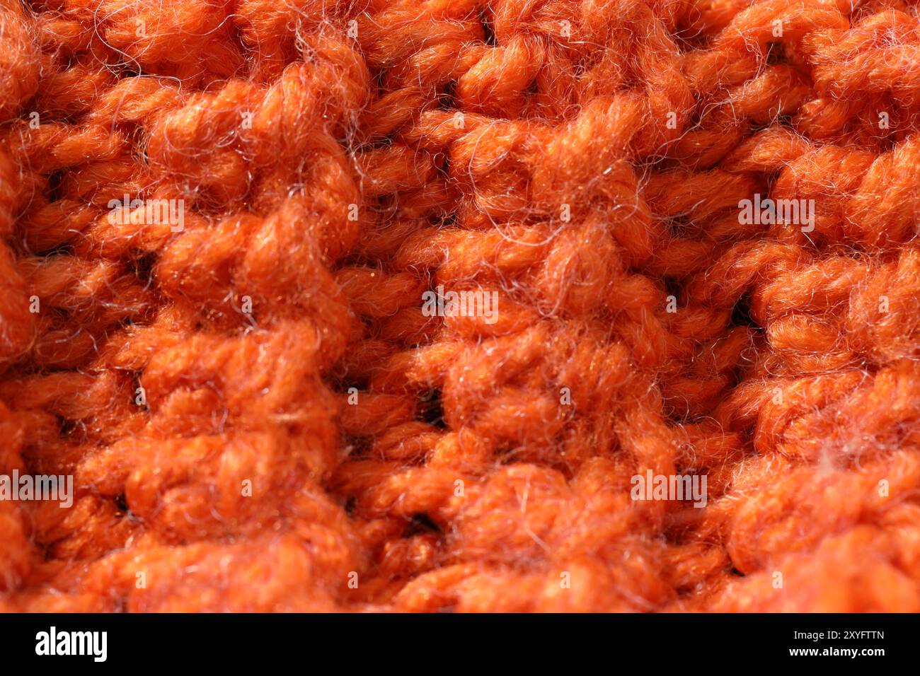 Texture of orange knitted fabric as background, closeup Stock Photo - Alamy
