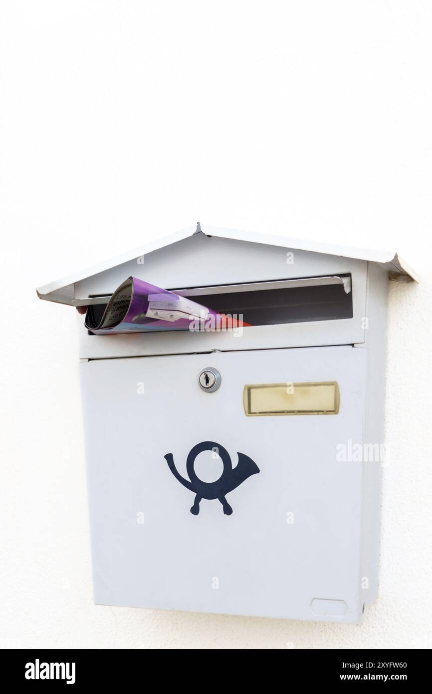 Mailbox with advertisement coming out of its interior isolated on white ...