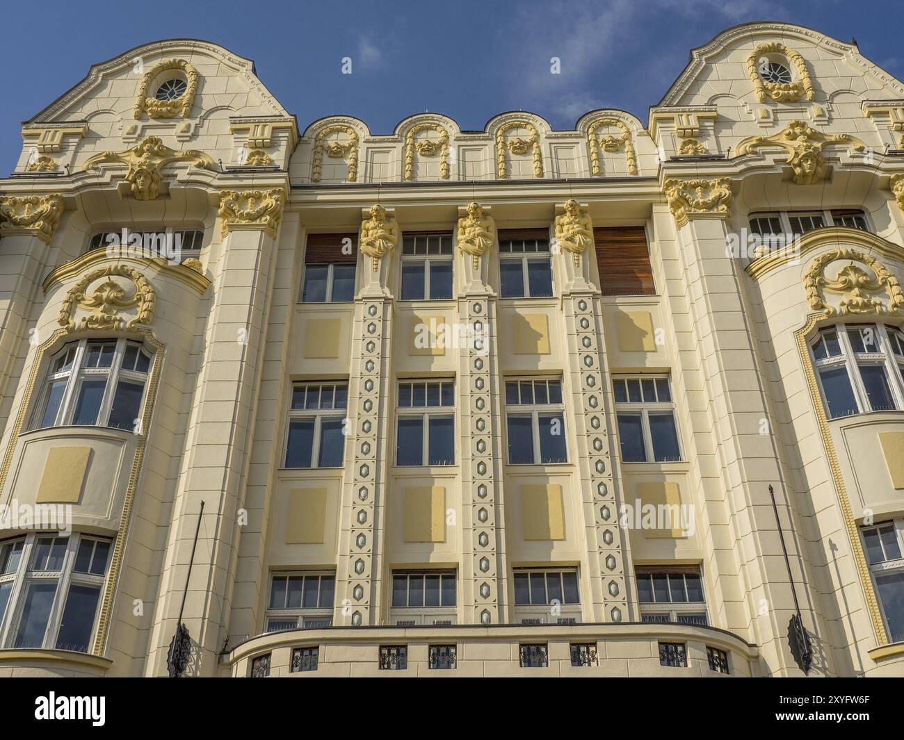 Historic building with ornate facade, stucco work and gilded elements ...