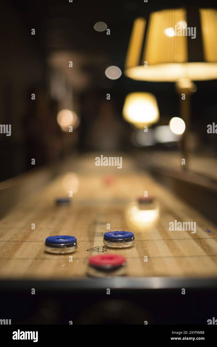 Playing the game of shuflleboard Stock Photo - Alamy