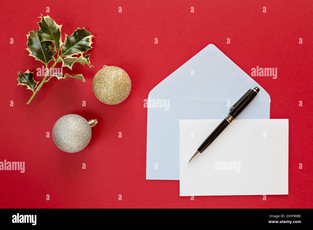 Christmas letter and pen over a red background with decorations Stock ...
