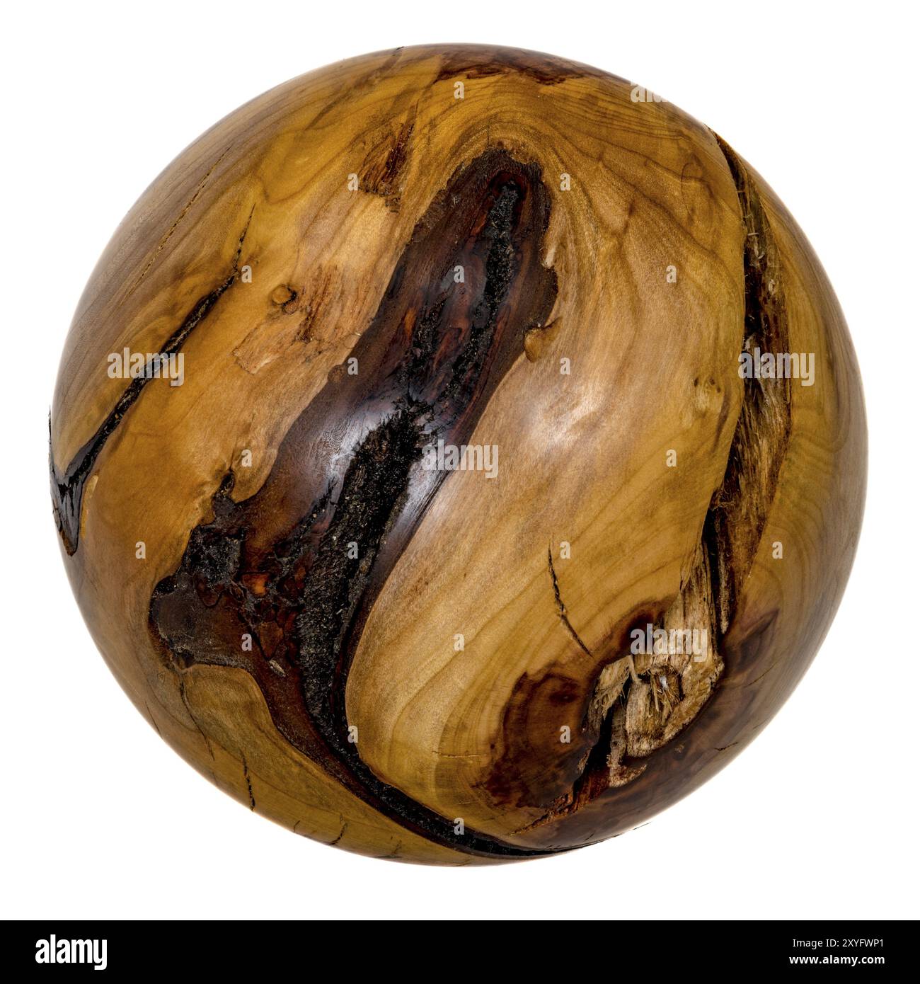 Turned dark brown ball made of wood with bark inclusions set free on ...