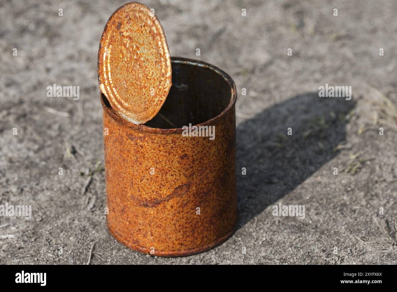 Empty rusty preserved food metal tin container can Stock Photo - Alamy