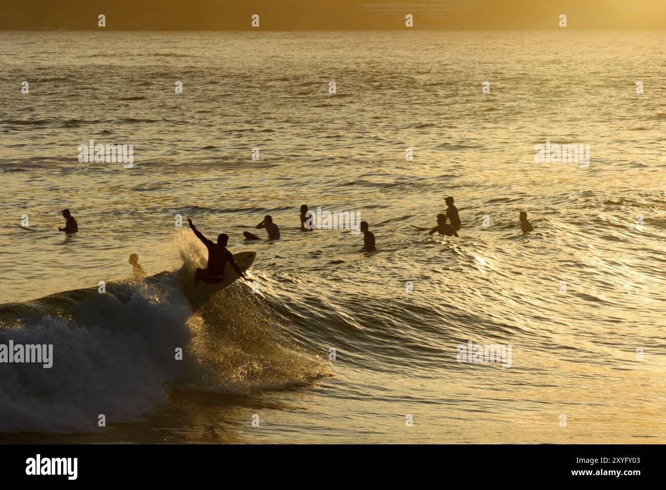 Surfing during the summer sunset at Ipanema beach in Rio de Janeiro ...