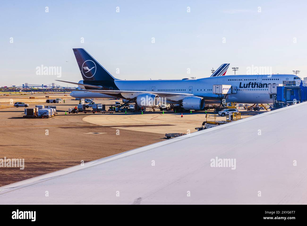 View from airplane window of parked Lufthansa Boeing 747 on the runway ...