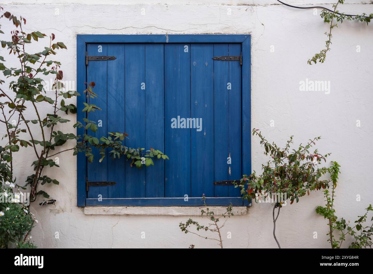 Greek style island house window with blue wooden frames Stock Photo - Alamy
