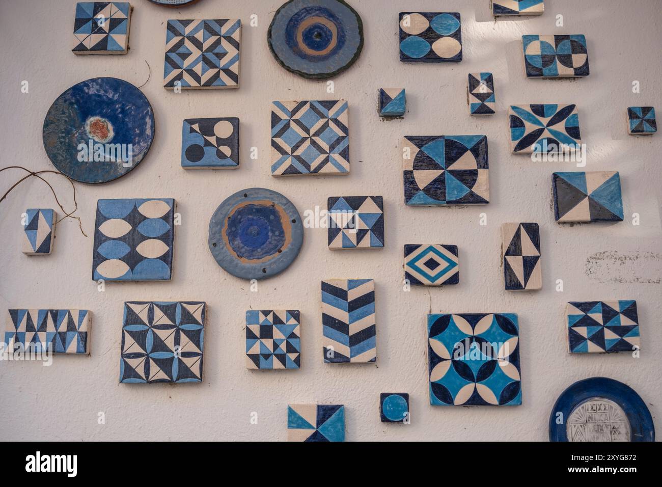 Greek style ceramic blue and white tiles on a wall Stock Photo - Alamy