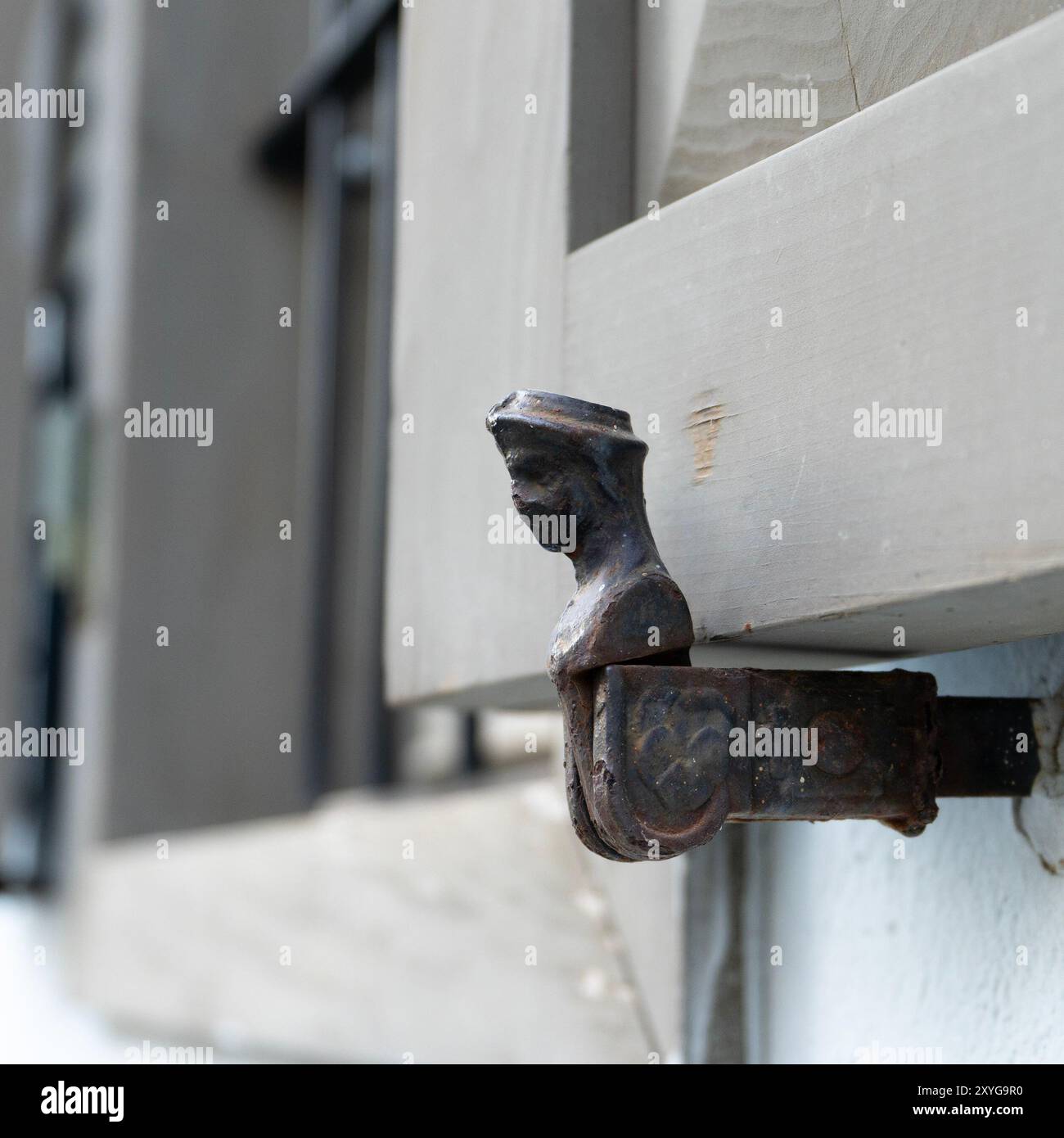A typical old fashioned window shutter holder in an old building in Tel ...
