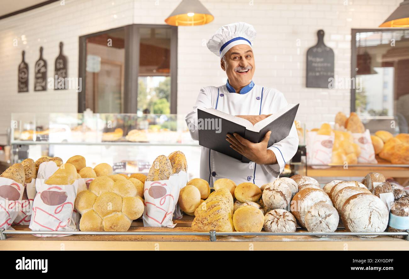 Happy man recipe book hi-res stock photography and images - Alamy