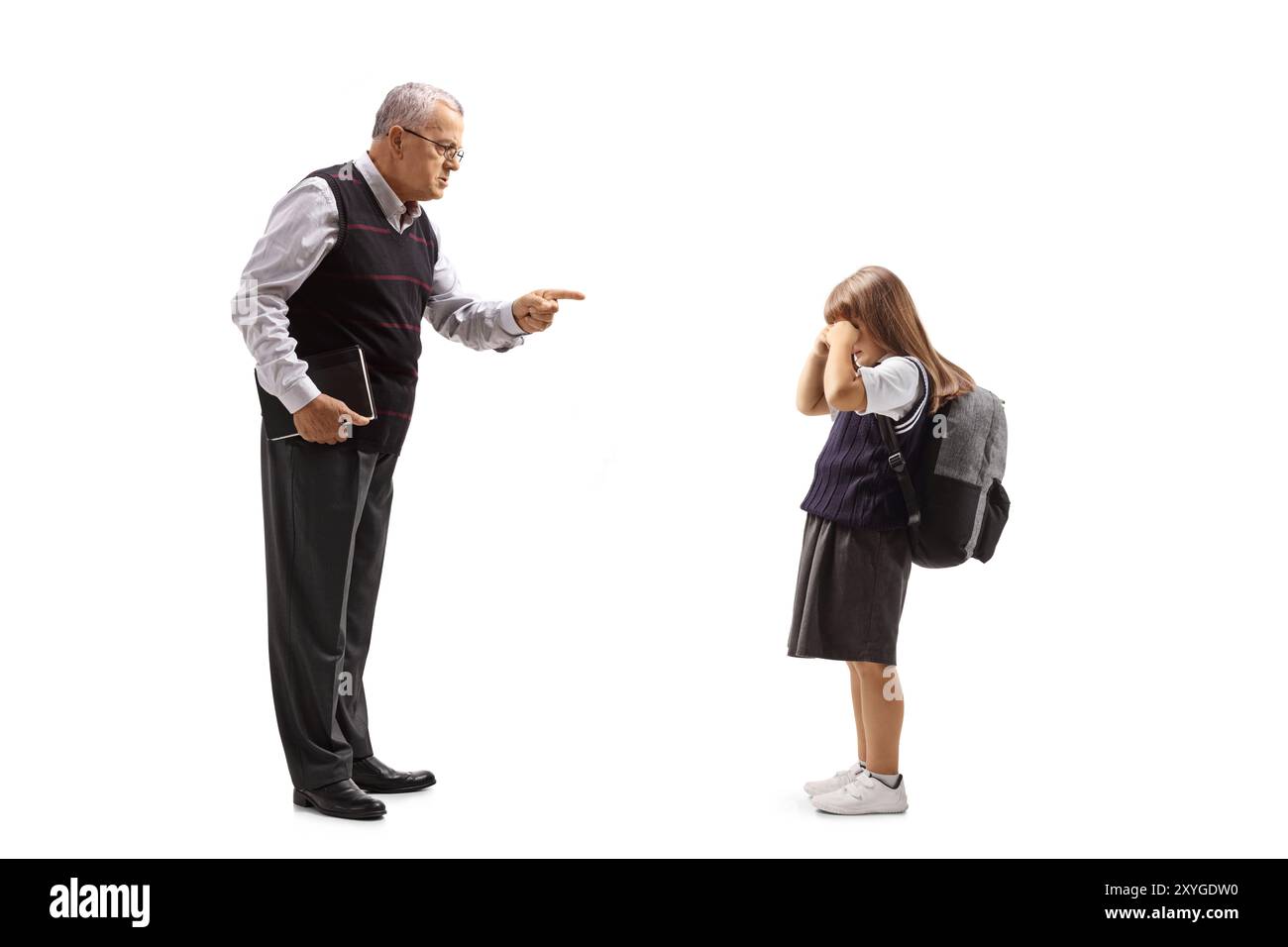Full length profile shot of a strict teacher scolding a schoolgirl ...