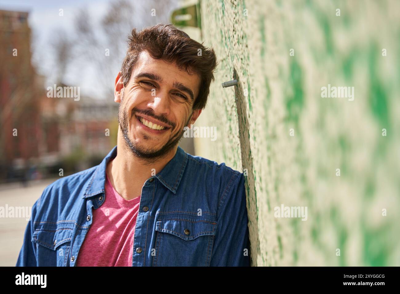 Businessman standing against green background hi-res stock photography ...