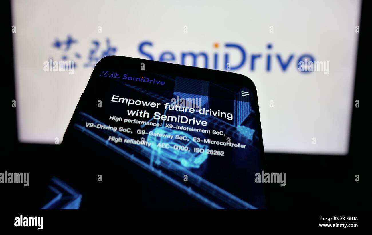 Mobile phone with website of Chinese company Beijing SemiDrive Technology Corporation in front ...