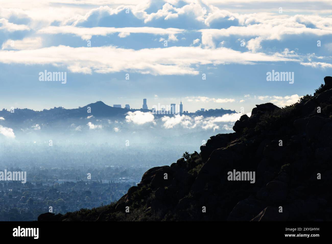 Downtown Los Angeles towers peaking over Santa Monica Mountains ridge ...