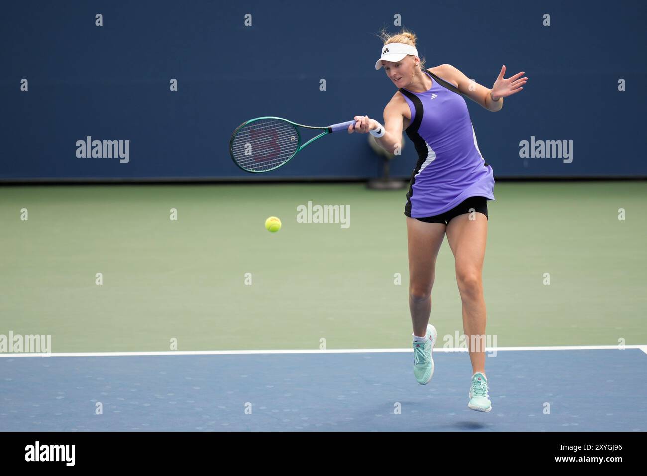 Ashlyn Krueger, of the United States, returns a shot to Mirra Andreeva ...