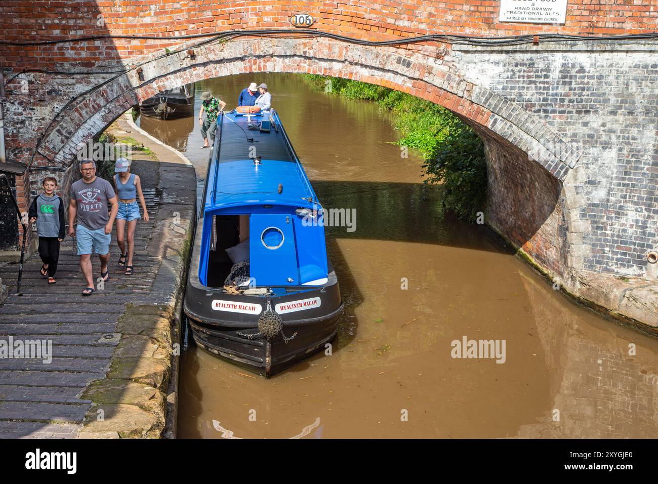Canal narrowboat approaching Bunbury double staircase locks on the ...