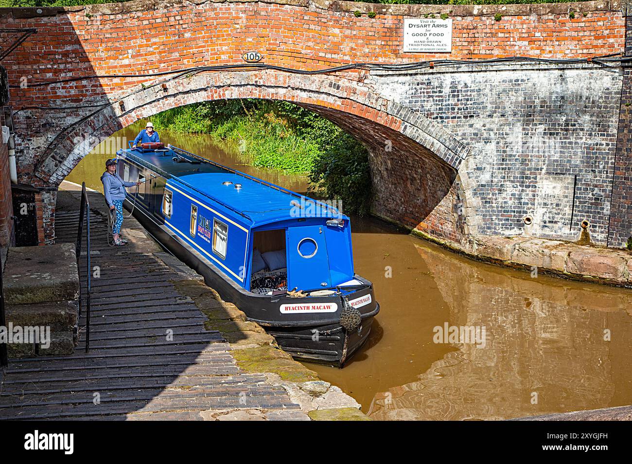 Canal narrowboat approaching Bunbury double staircase lock on the ...