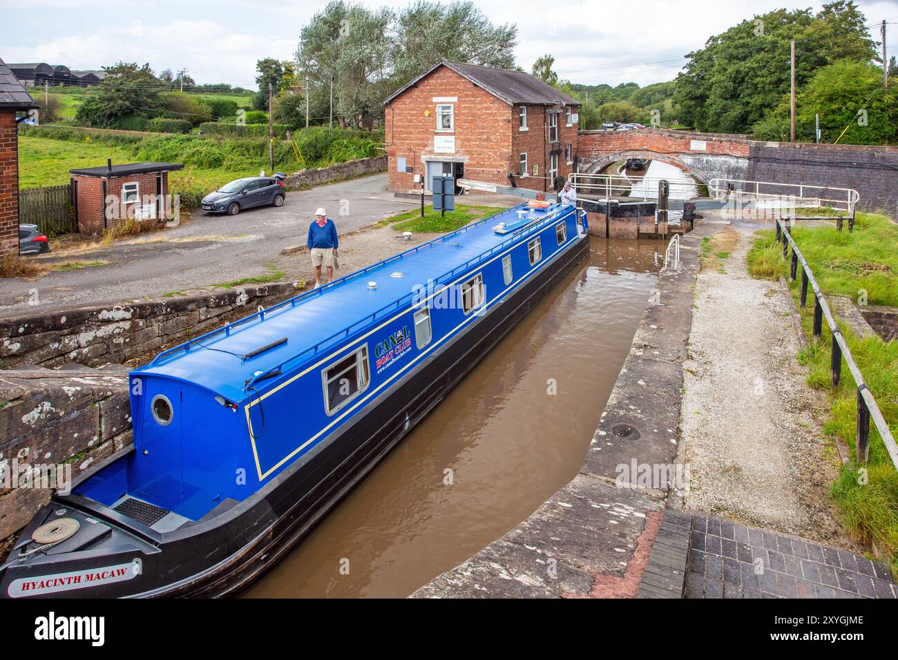 Narrowboat passing through the double staircase twin locks on the ...