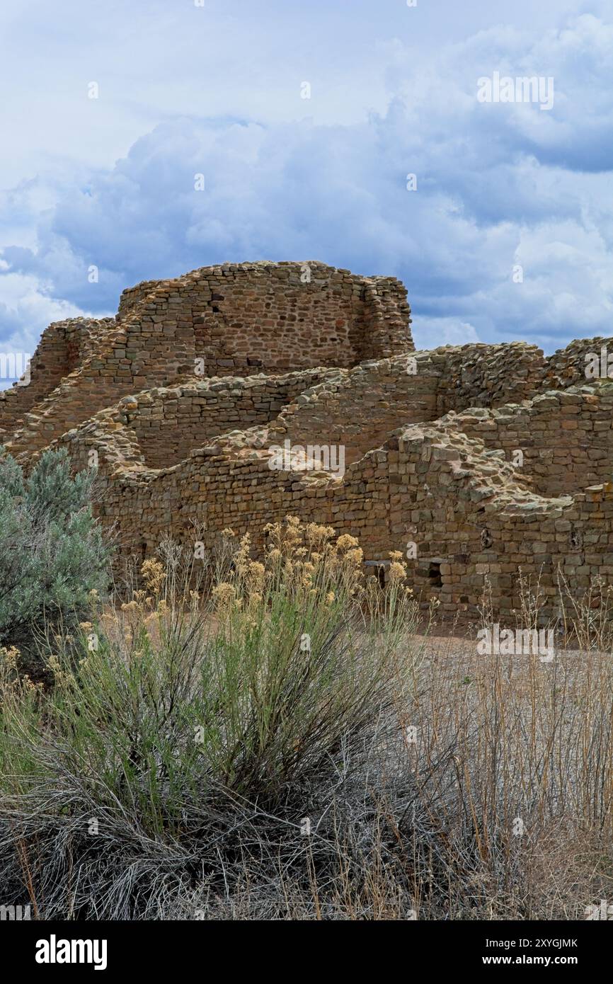 Stone masonry walls of ancient Puebloan great house under moody blue ...