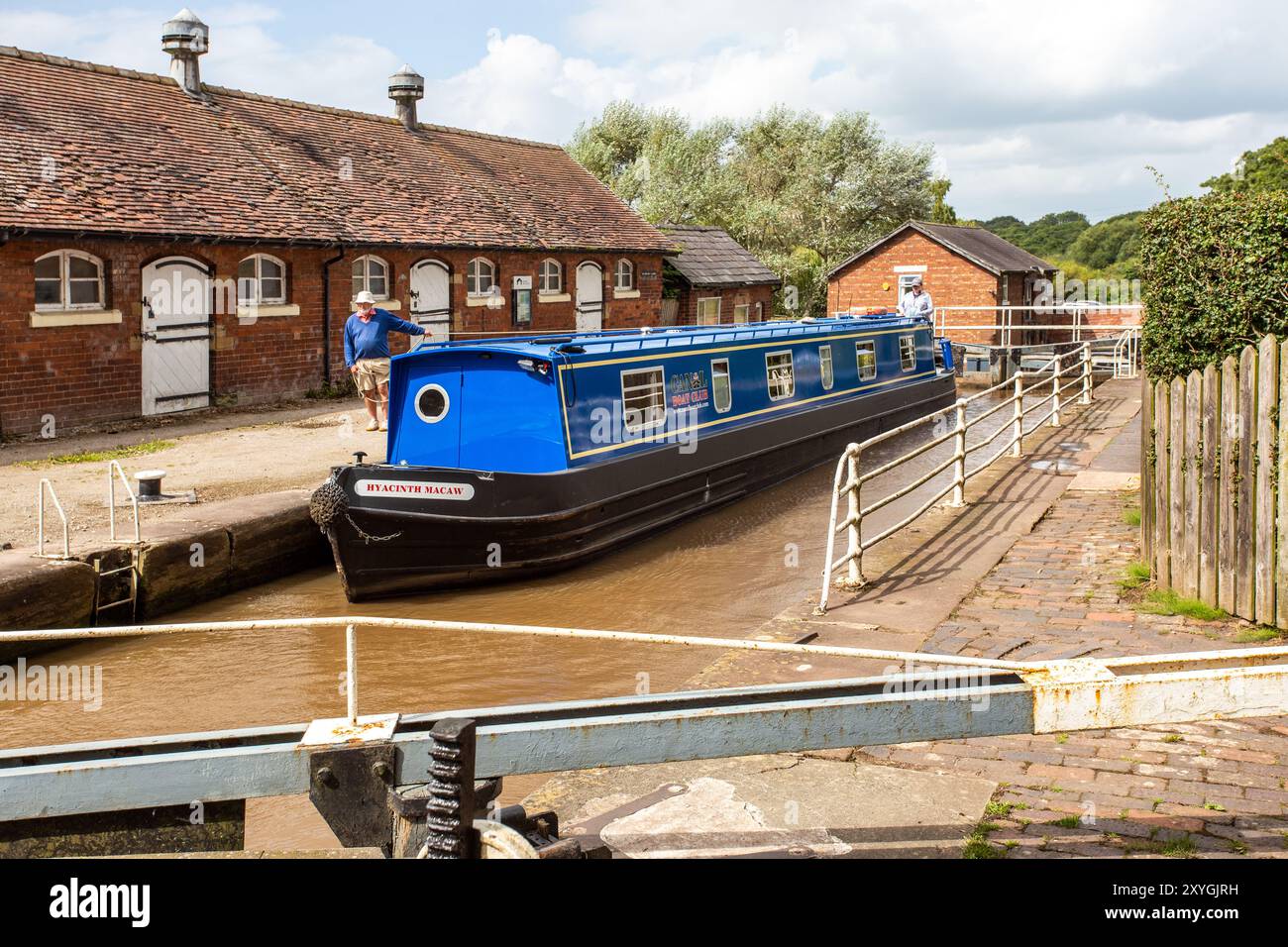 Narrowboat passing through the double staircase twin locks on the ...