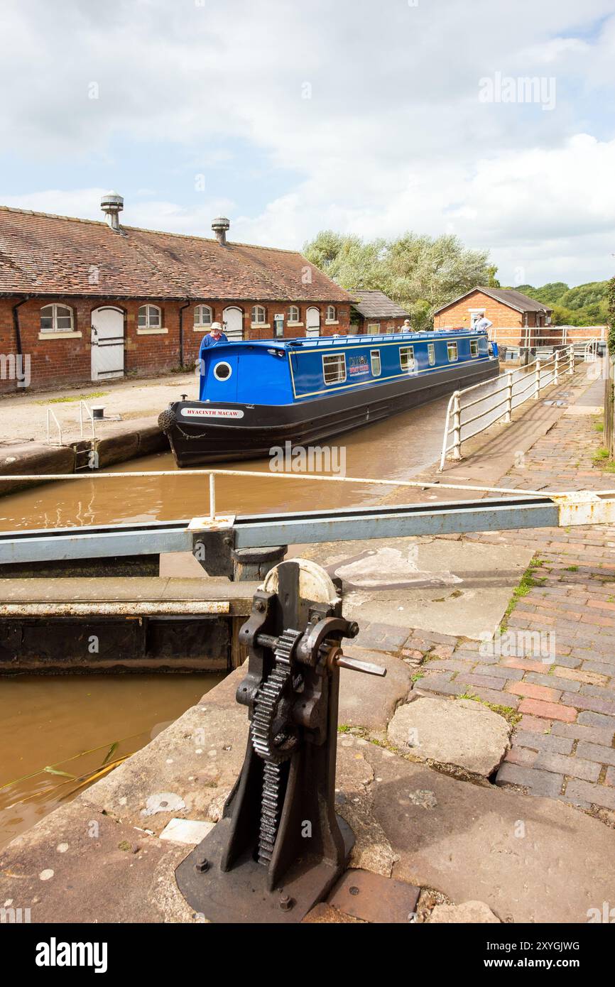 Narrowboat passing through the double staircase twin locks on the ...