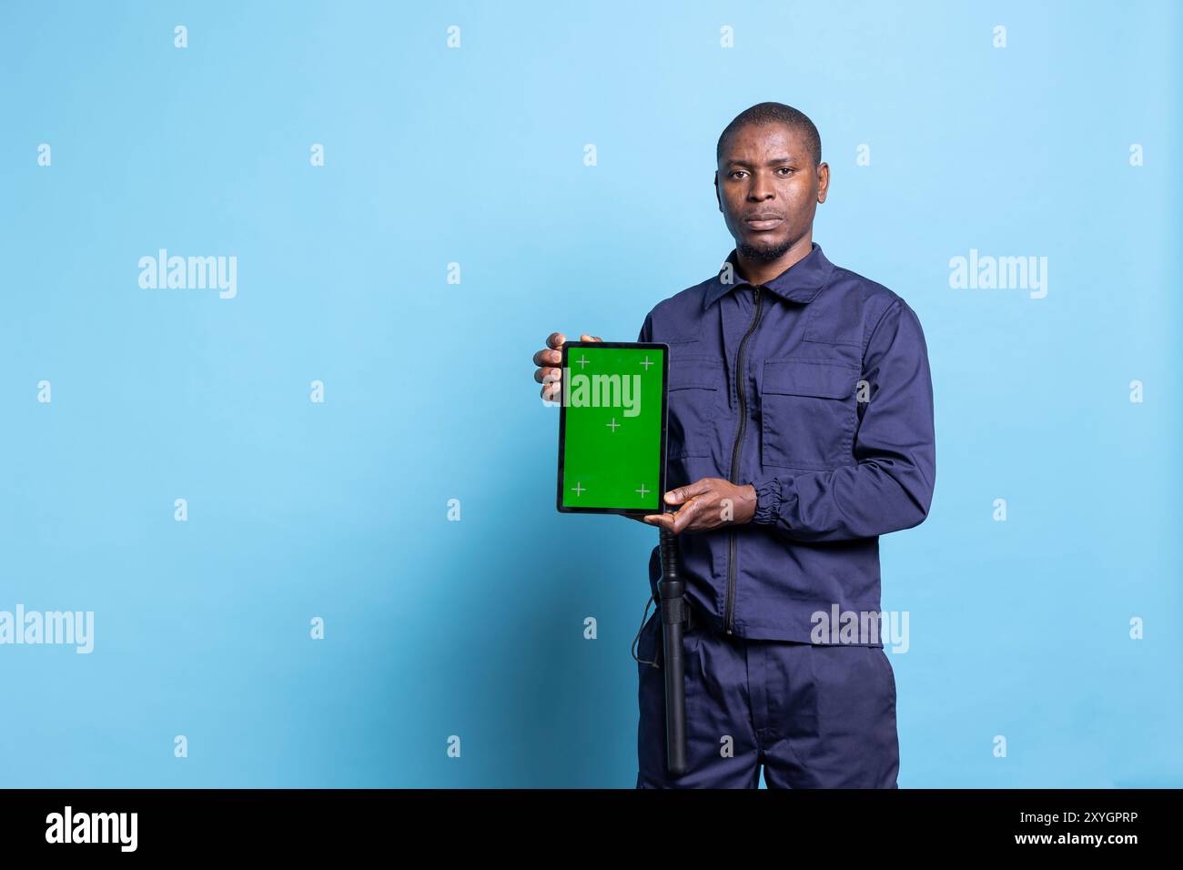 Mall security guard showing a tablet with isolated copyspace display on ...