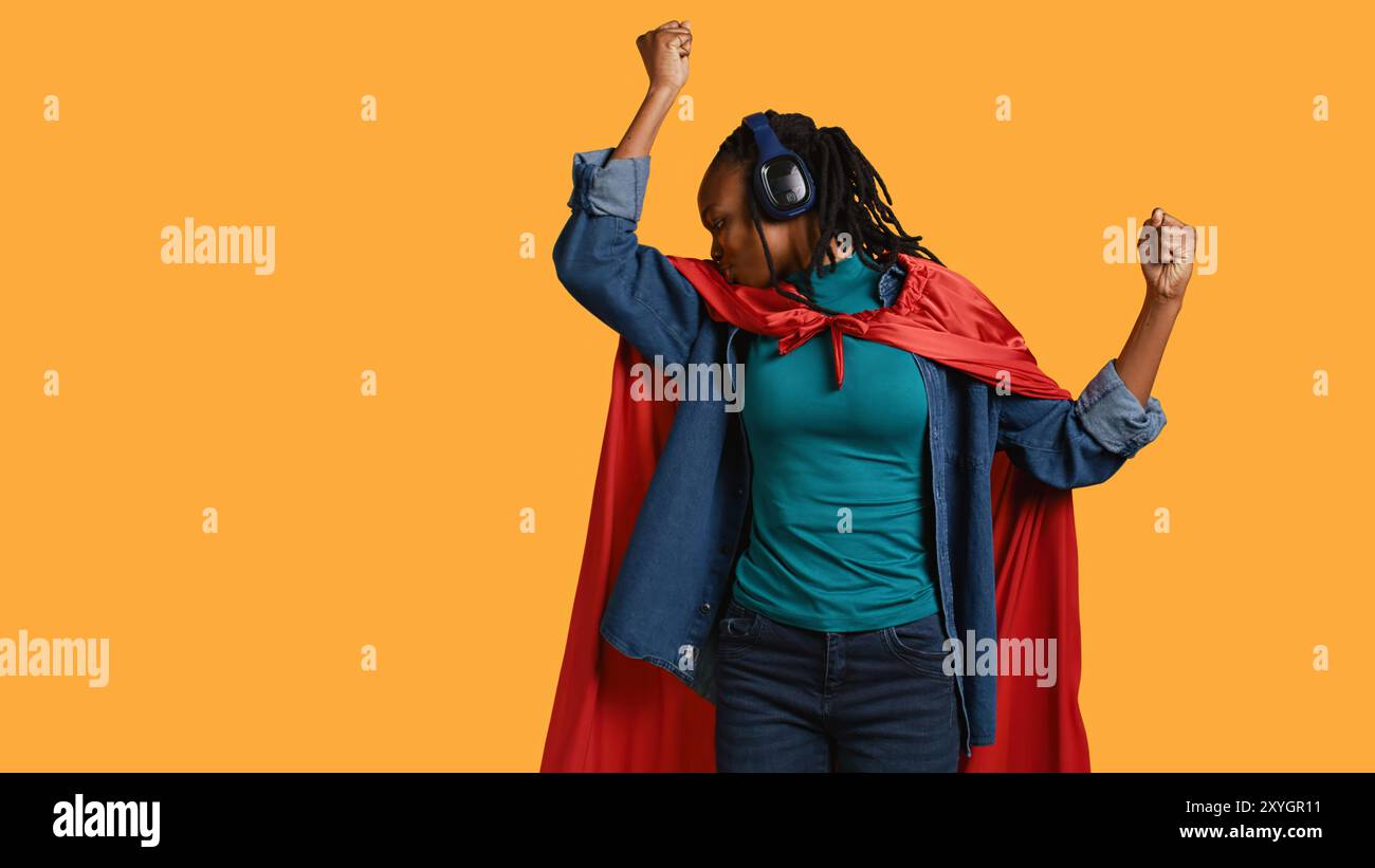 African american superhero with red cape flexing muscles, isolated over ...