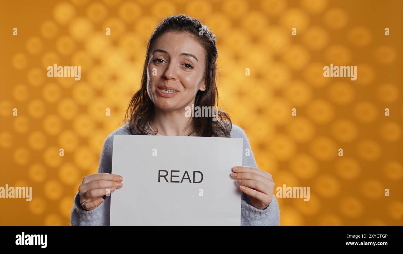 Woman holding message in hands urging people to read more, talking ...