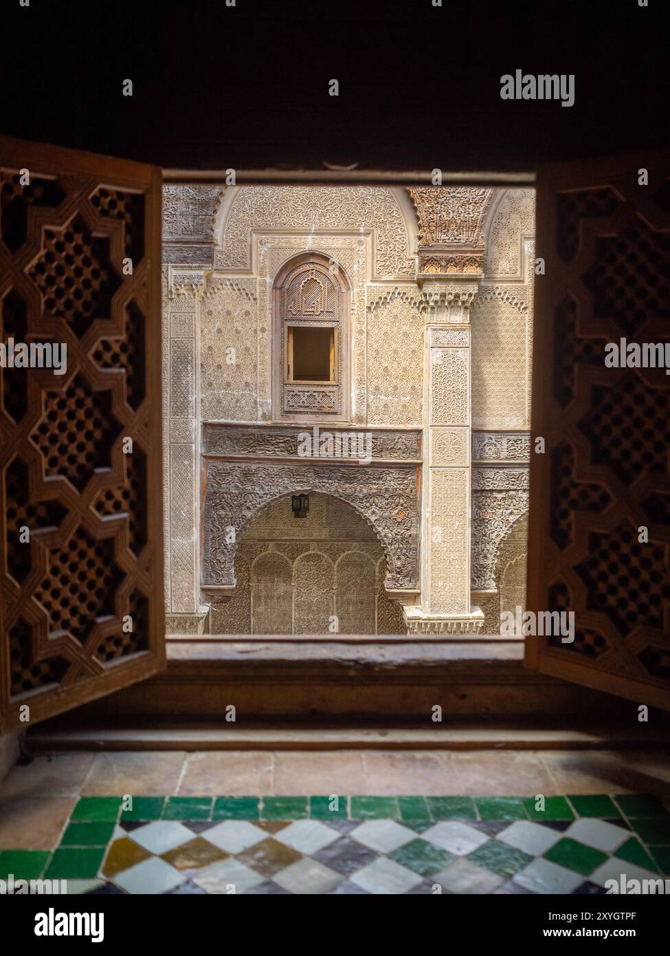 Mesbahiyya Madrasa courtyard seen through a small room window, Fez ...