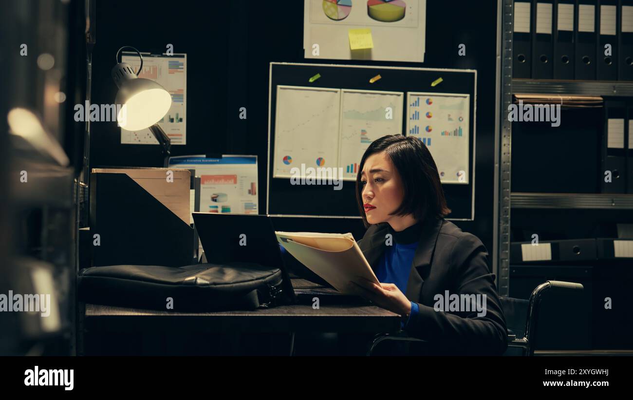 Investigator reading criminology files hi-res stock photography and ...