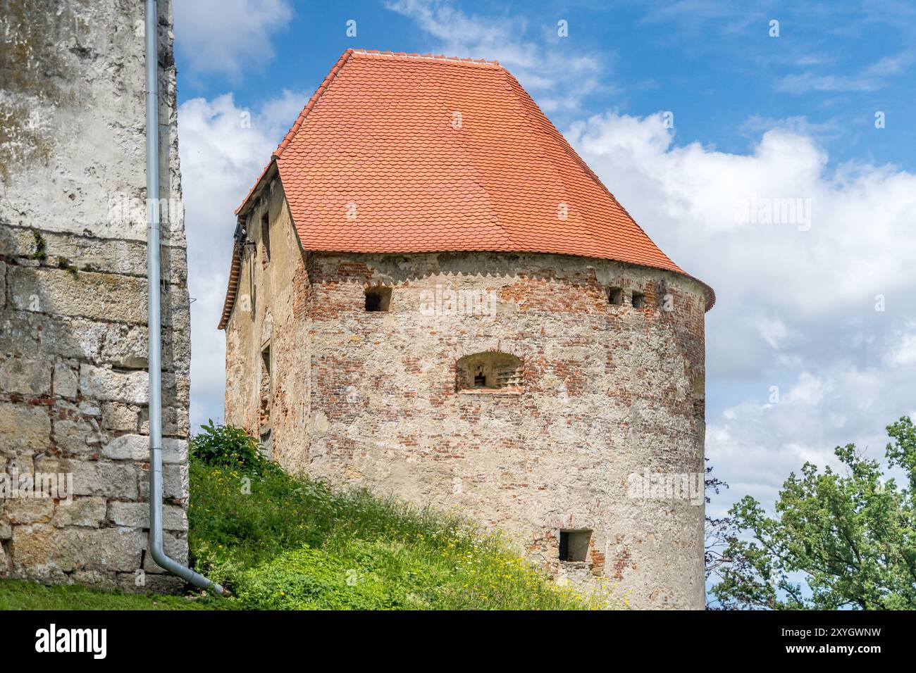 Round cannon gun tower with loopholes, red roof in Ptuj castle Slovenia ...