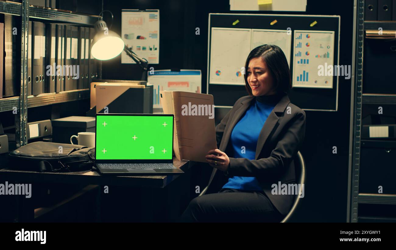 Private inspector examining legal documents and uses greenscreen on ...