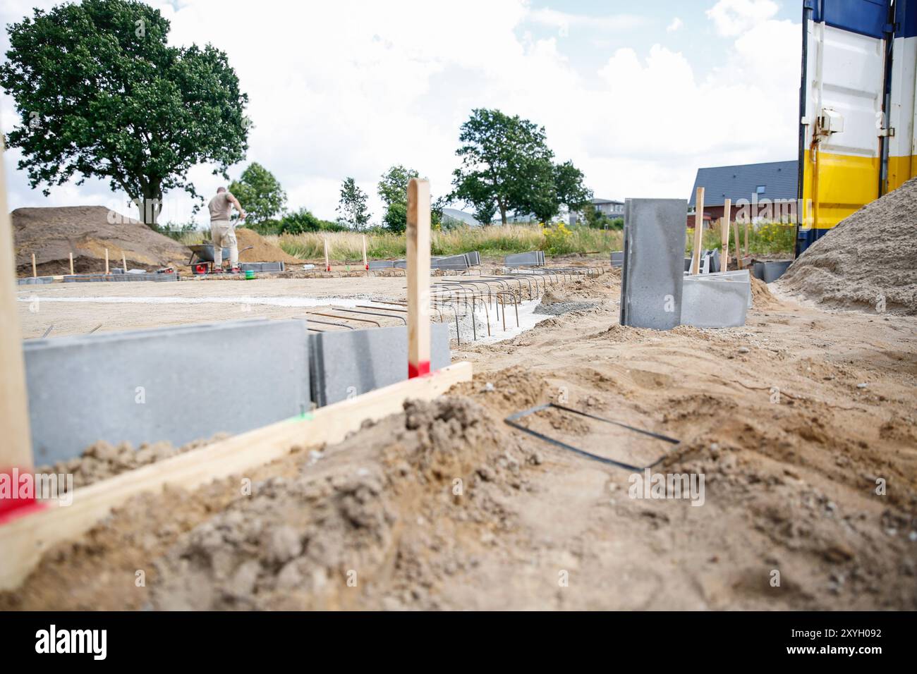 Dugged holes filled with concrete on a construction site. Building ...