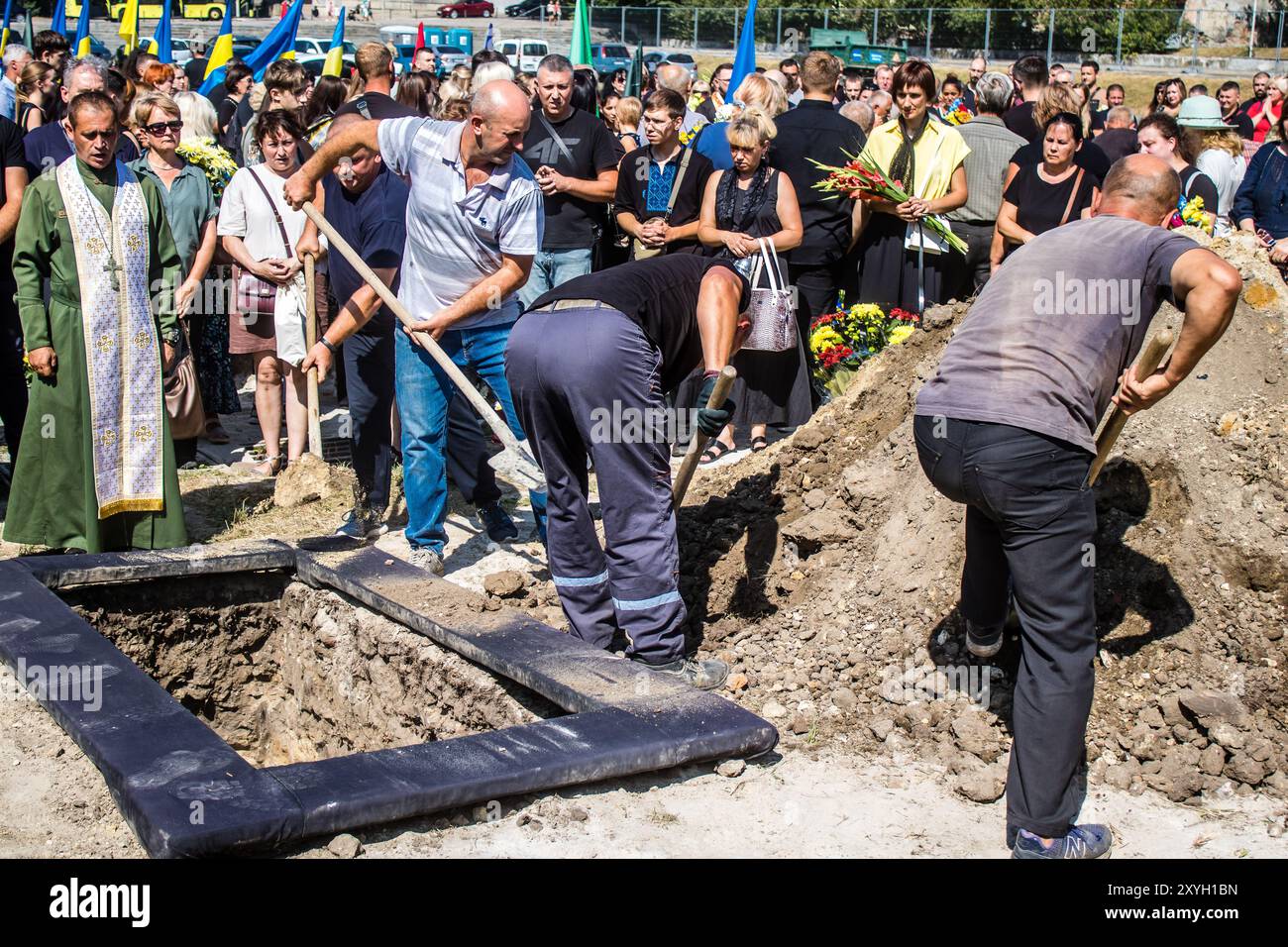 Lviv, Ukraine, August 29, 2024 Burial by gravediggers at the Field of ...