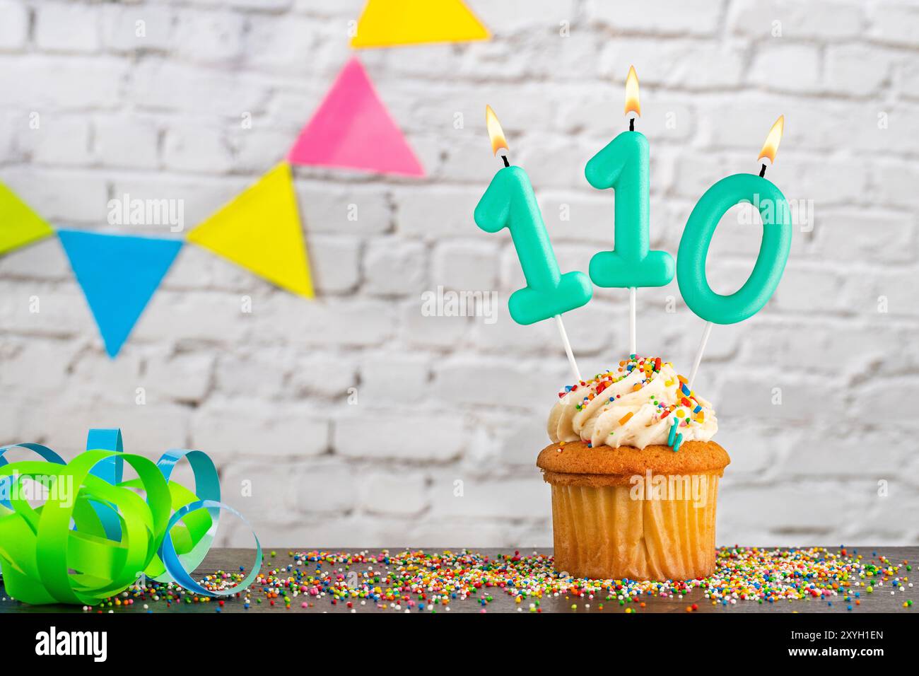 Candle number 110 - Birthday celebration with cupcake Stock Photo - Alamy