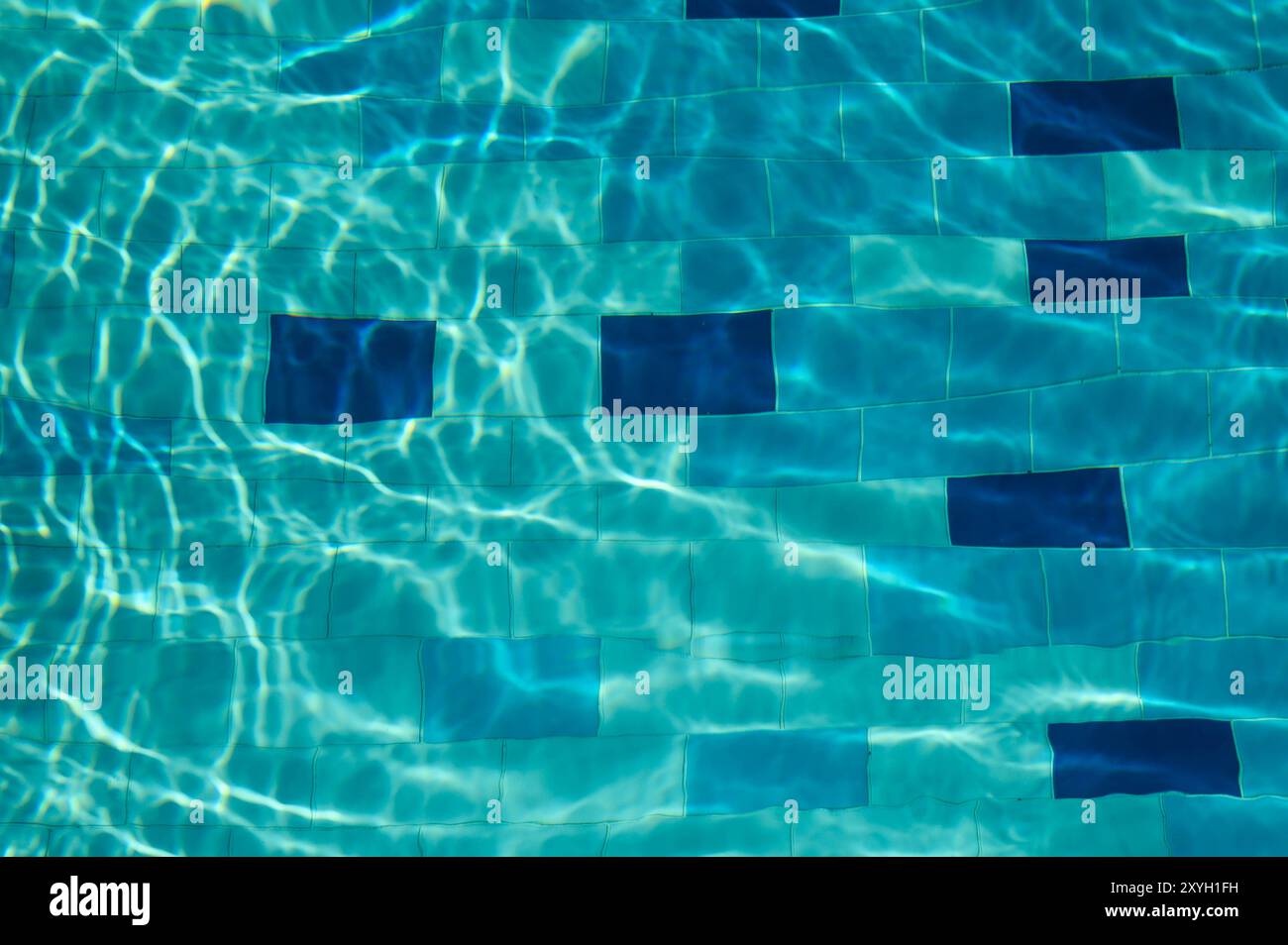 Underwater view of sunlight reflecting on the swimming pool floor ...