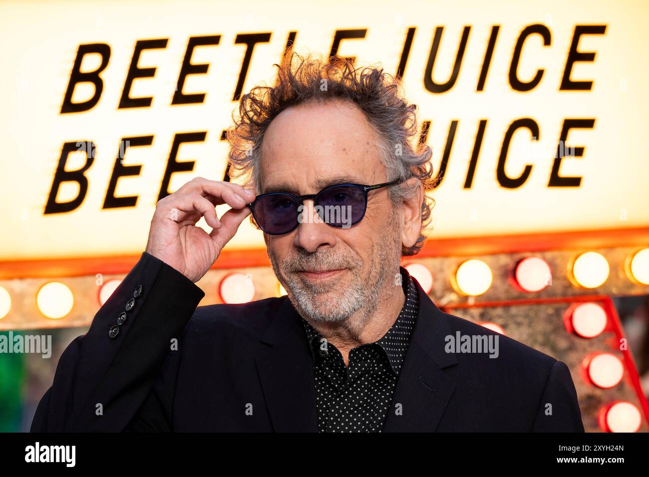 Tim Burton poses for photographers at the UK premiere of "Beetlejuice ...