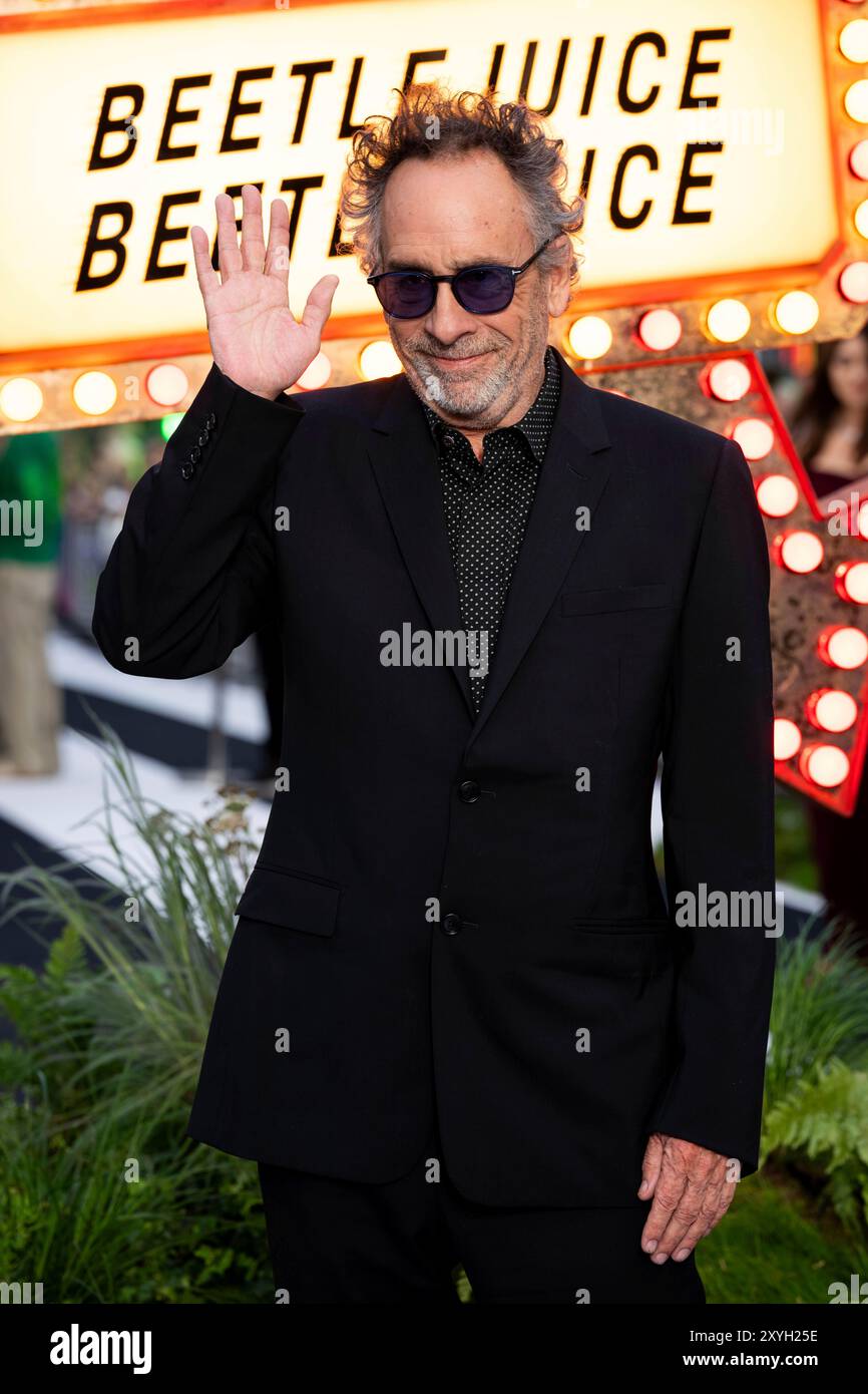 Tim Burton poses for photographers at the UK premiere of "Beetlejuice ...
