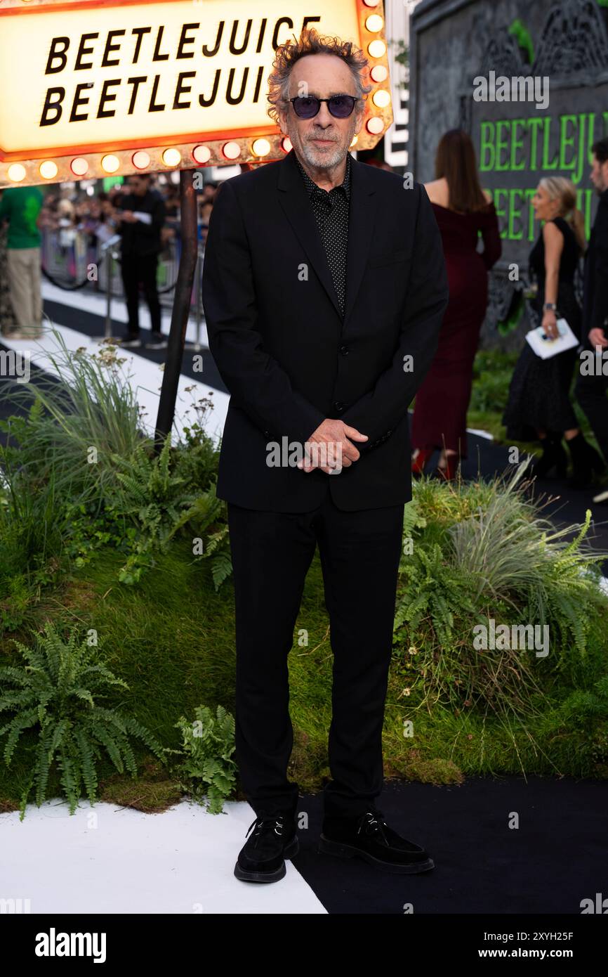 Tim Burton poses for photographers at the UK premiere of "Beetlejuice ...