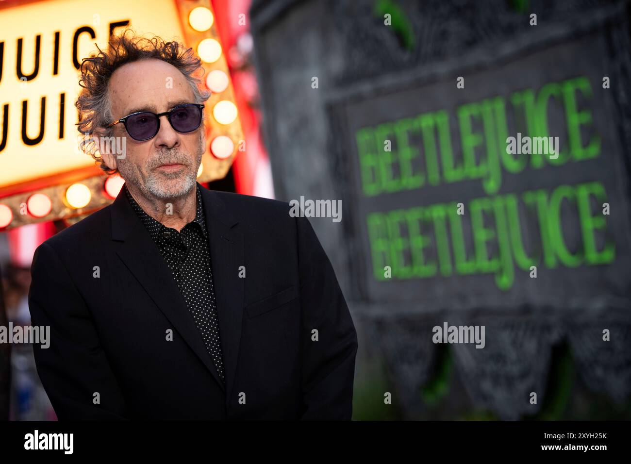 Tim Burton poses for photographers at the UK premiere of "Beetlejuice ...