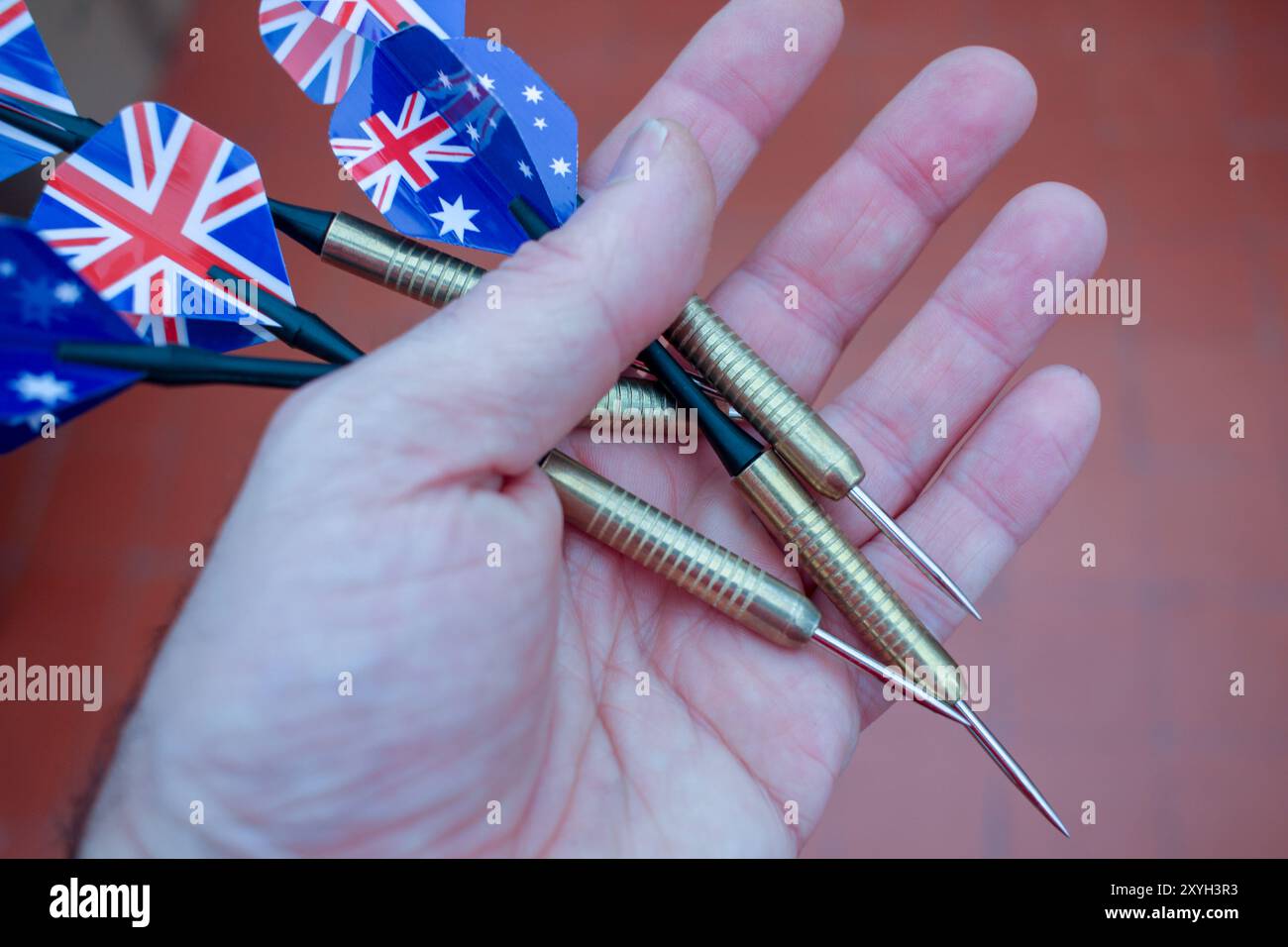 Hand holding dart hi-res stock photography and images - Alamy