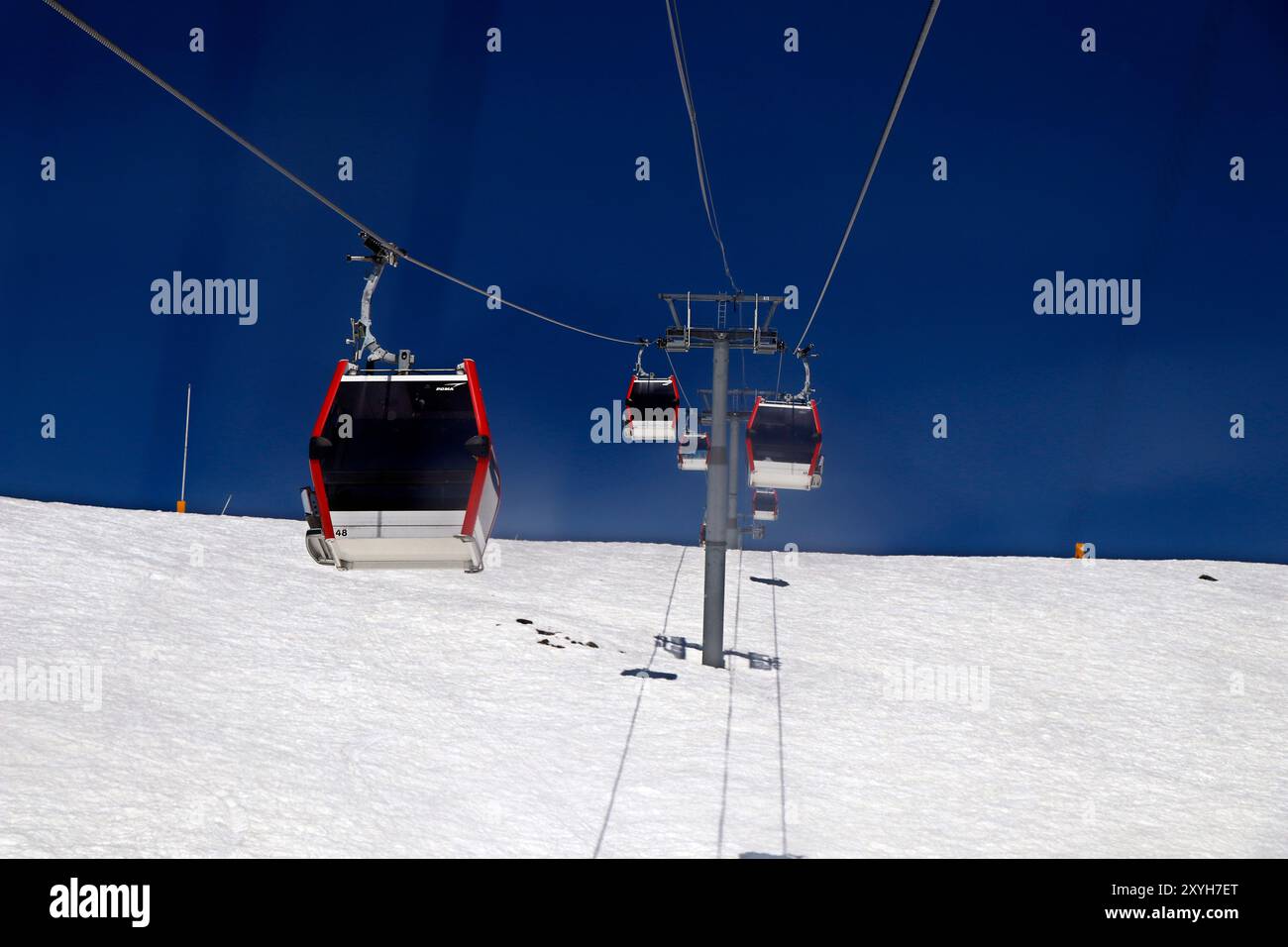 snow covered caucasus mountain and valley with cable car transportation ...