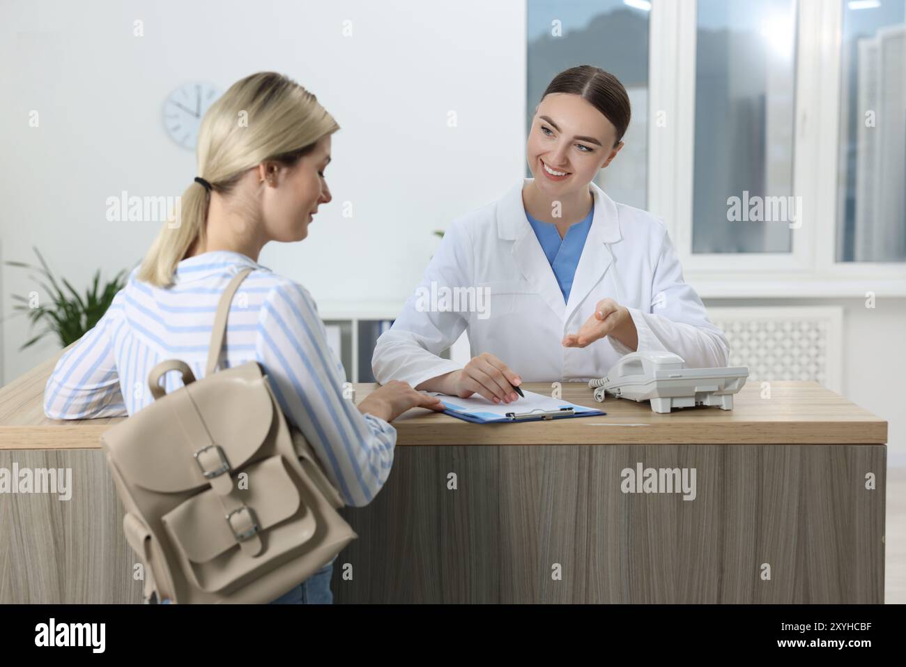 Patient document nurse reception hi-res stock photography and images ...