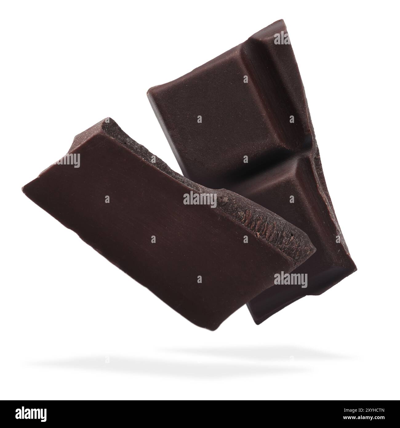 Pieces of sweet chocolate falling on white background Stock Photo - Alamy
