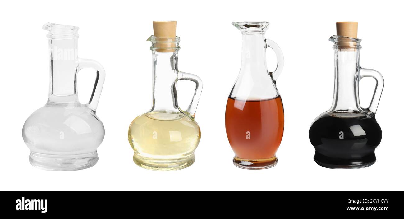 Different types of vinegar in glass bottles isolated on white, set ...
