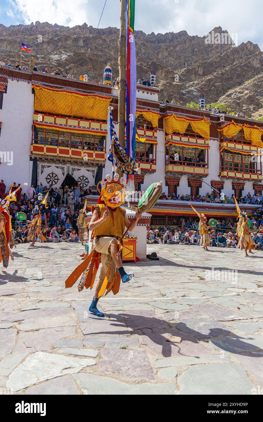 Young Buddhist monks dressed in traditional costume beating drum at ...