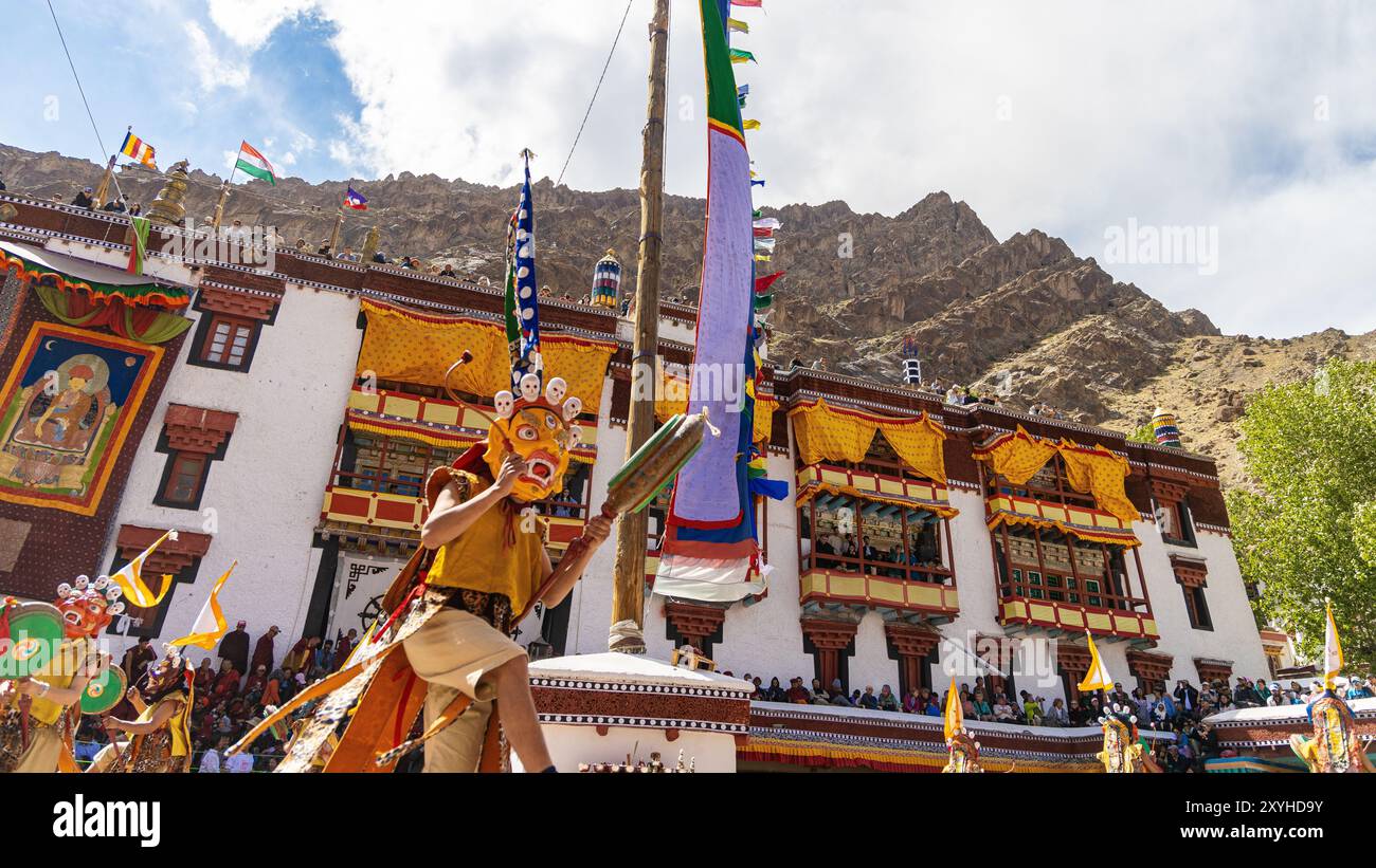 Young Buddhist monks dressed in traditional costume beating drum at ...