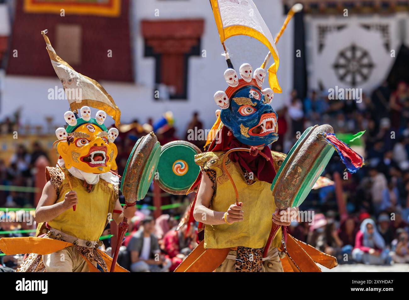 Young Buddhist monks dressed in traditional costume beating drum at ...