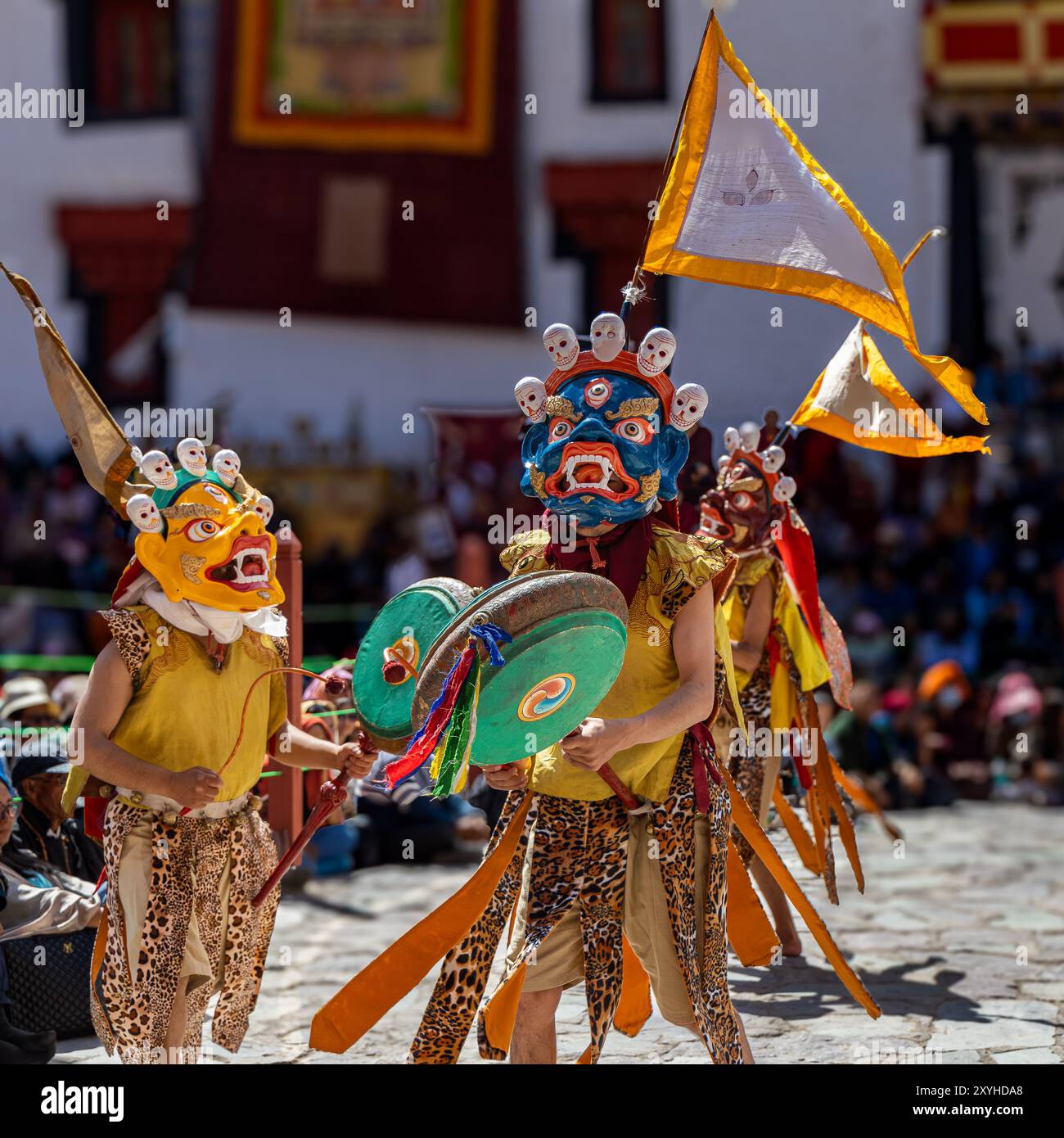 Young Buddhist monks dressed in traditional costume beating drum at ...