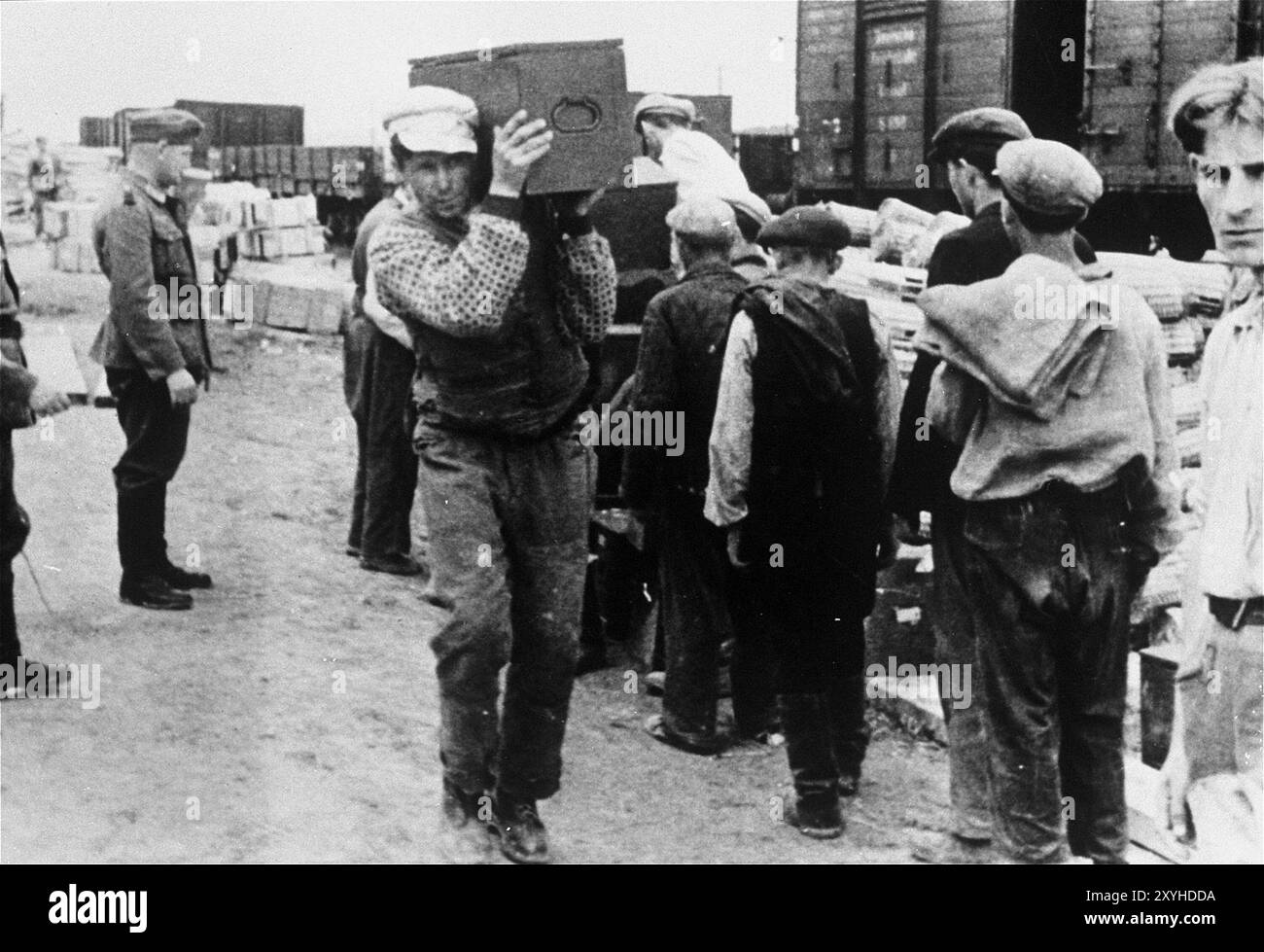Jewish men are forced to load a German munitions train near Lublin in ...