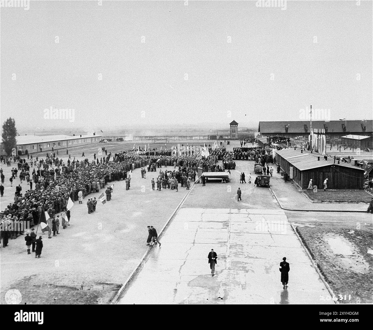 Survivors gather in the main yard of the Dachau concentration camp to ...